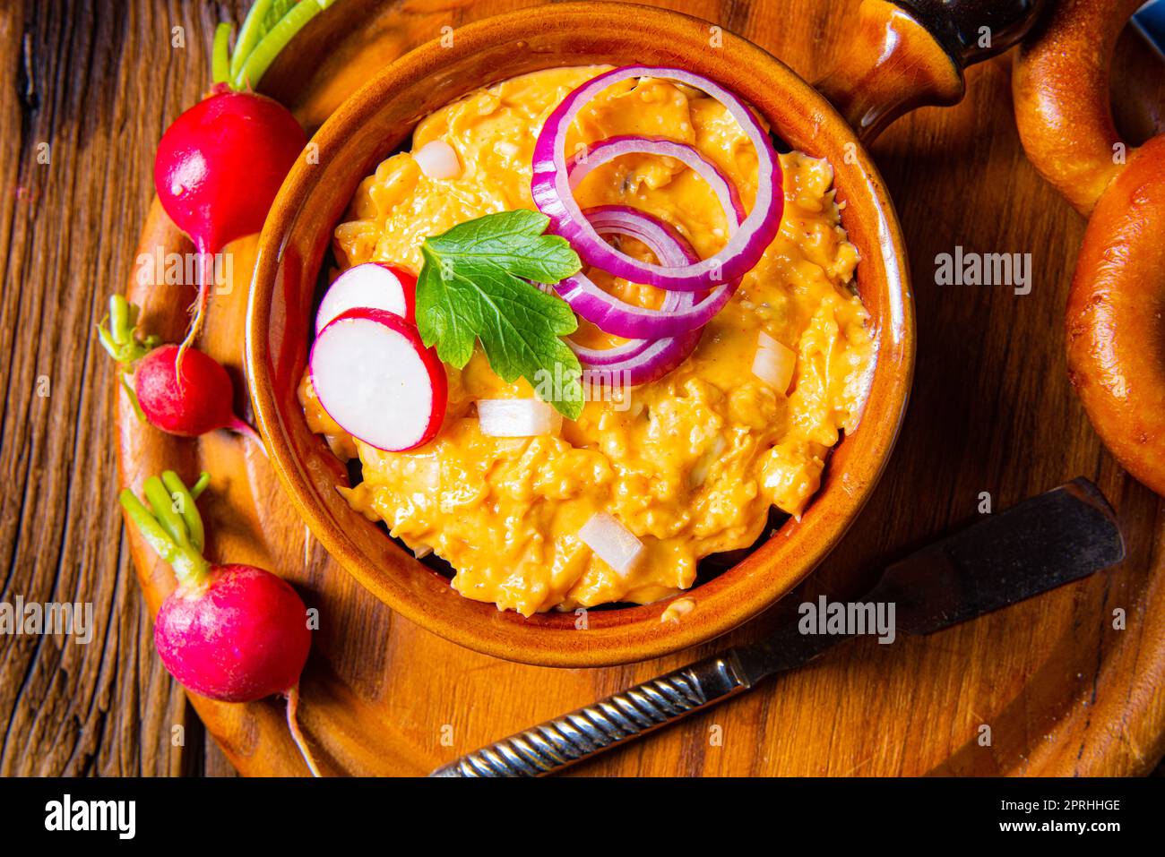 rustic Bavarian obazda with radishes and onions Stock Photo - Alamy