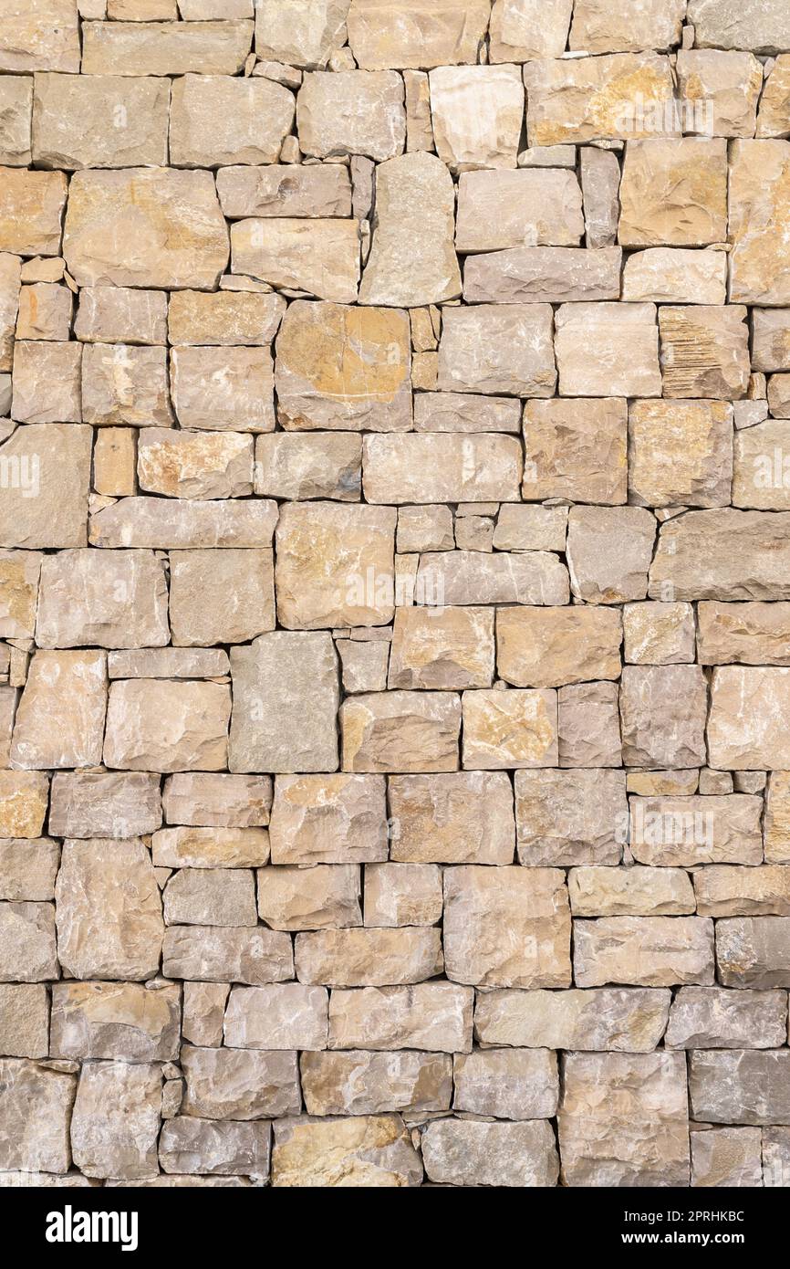 Walls made of stone. Old wall background Stock Photo - Alamy