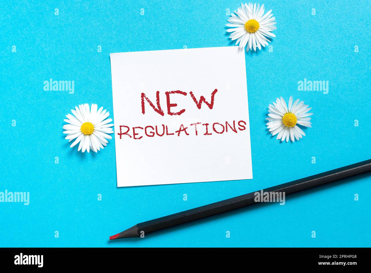 Hand writing sign New RegulationsRegulation controlling the activity ...