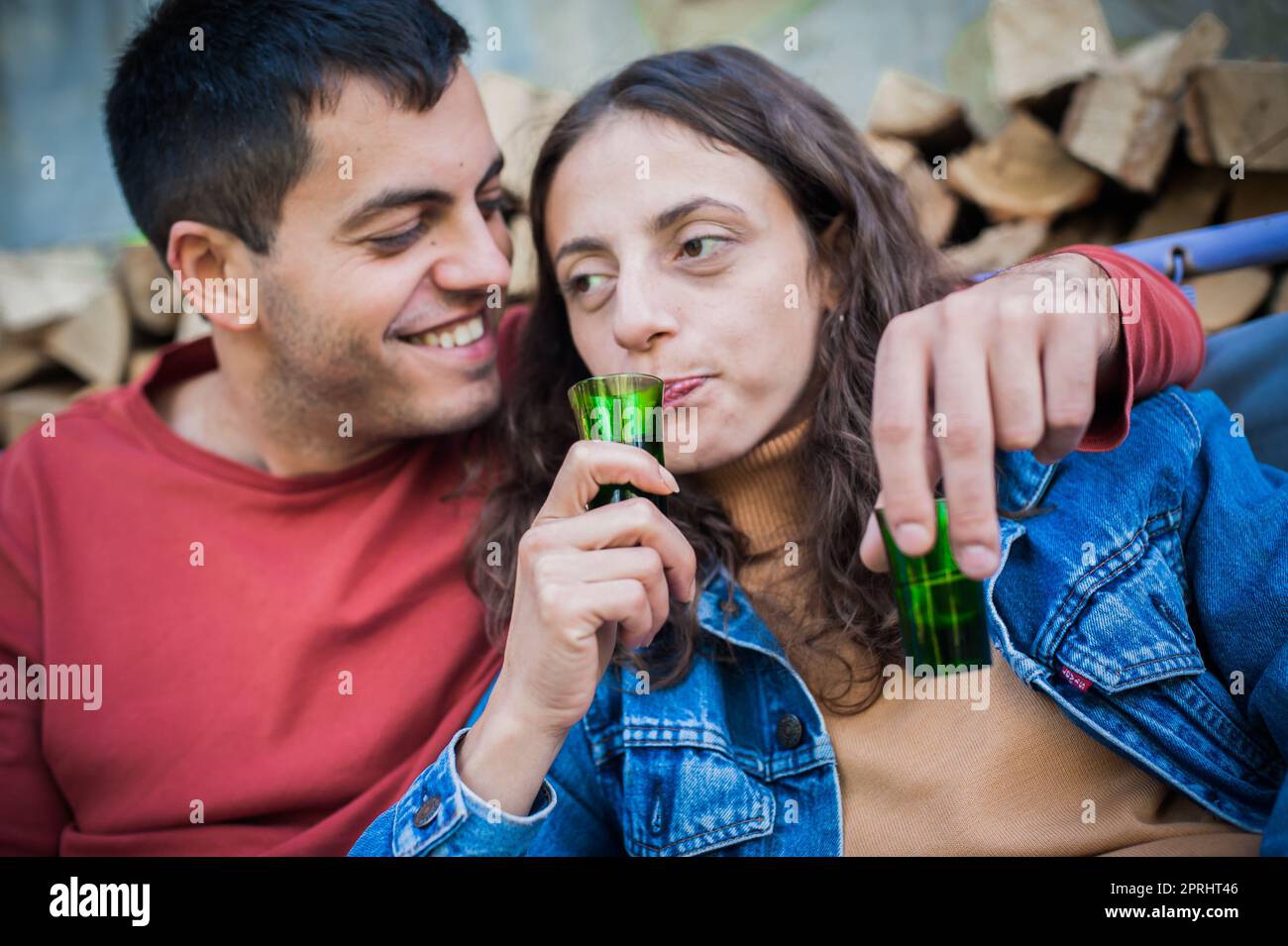 A very drunk hugging couple in love. Drink a strong alcoholic drink ...