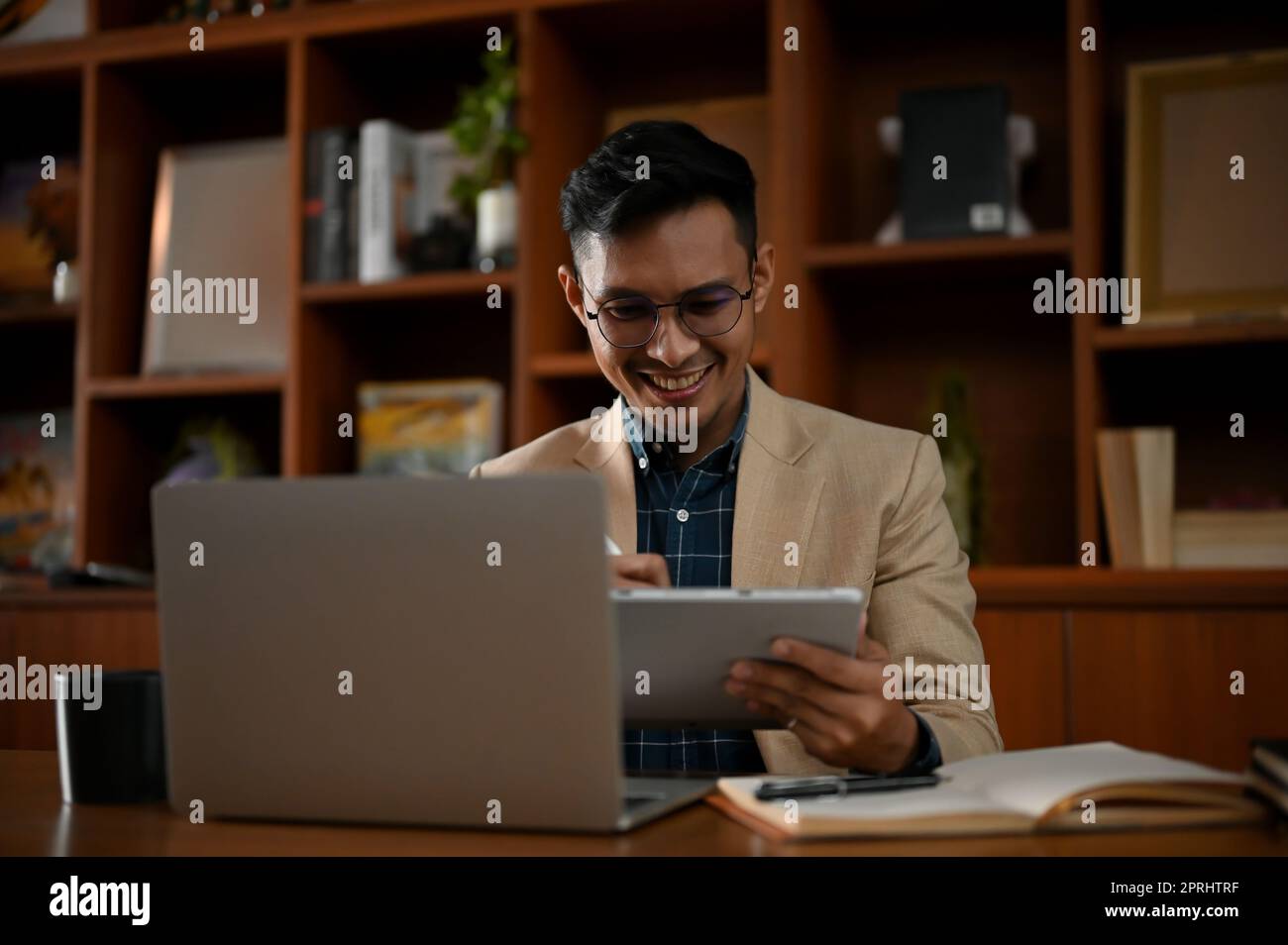 Professional and smart adult Asian businessman or male boss using his ...