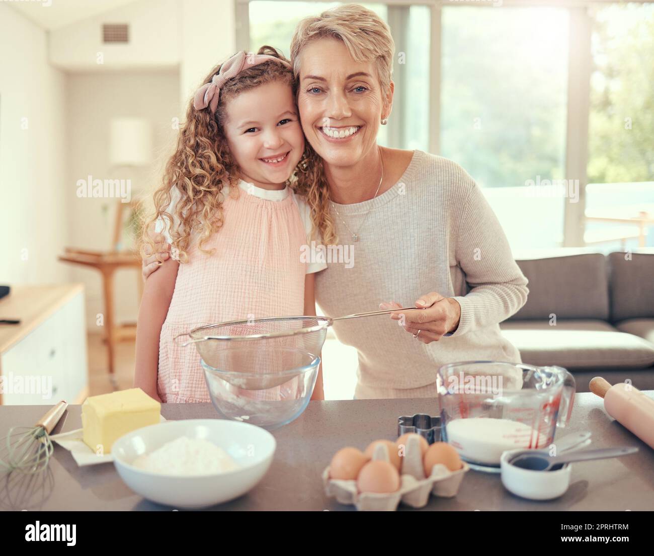 Portrait, mother and child baking in a happy family kitchen with young ...