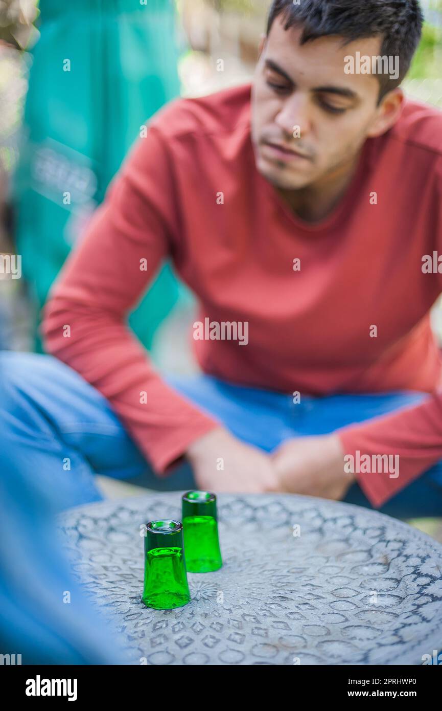 Very drunk couple, a boy and a girl, drink a strong alcoholic shot ...