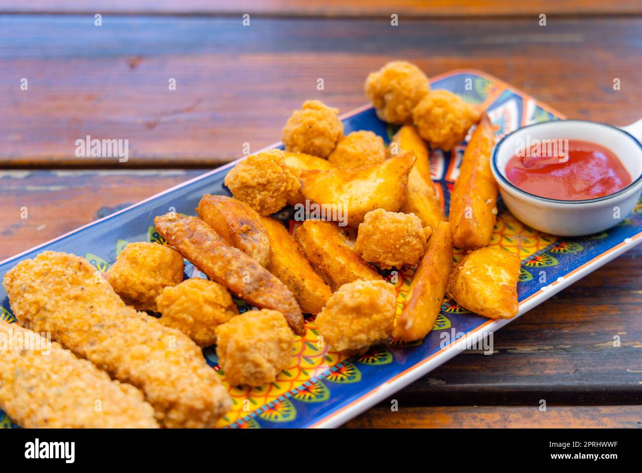 Fry fish finger and potato wedges Stock Photo - Alamy