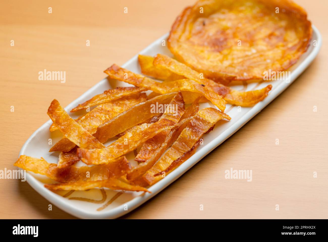 Cooked dried fish fillet snack Stock Photo - Alamy