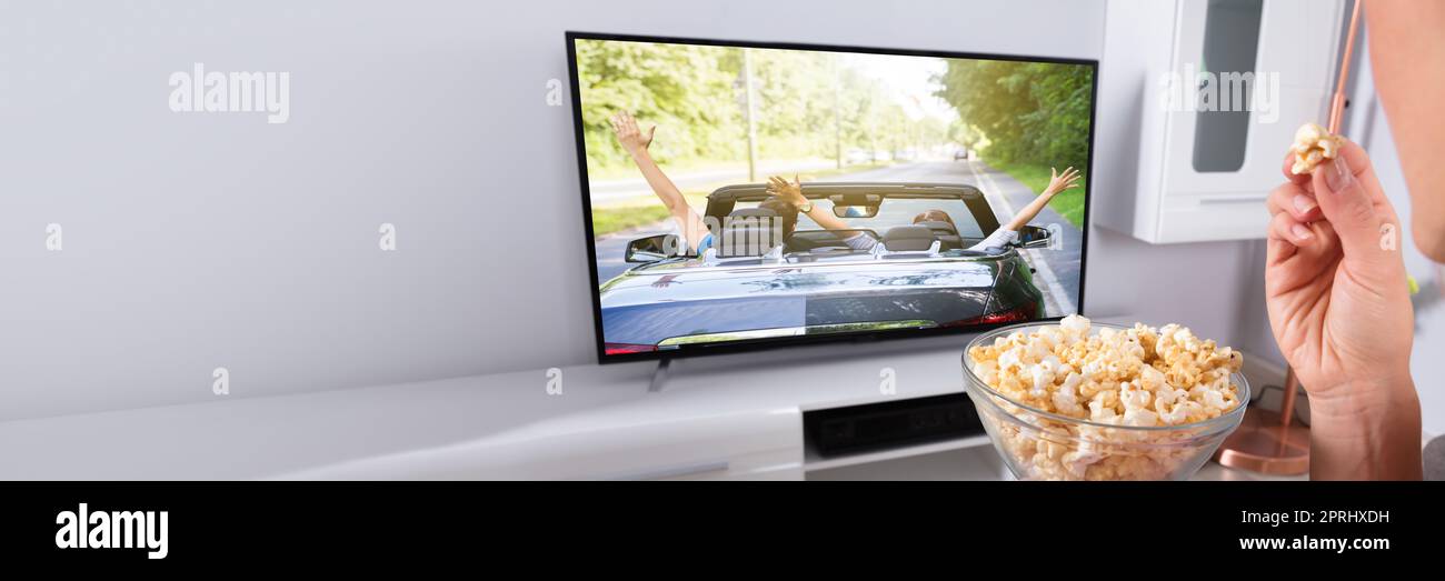 Watching TV Movie Eating Popcorn. Movie Screen Stock Photo - Alamy