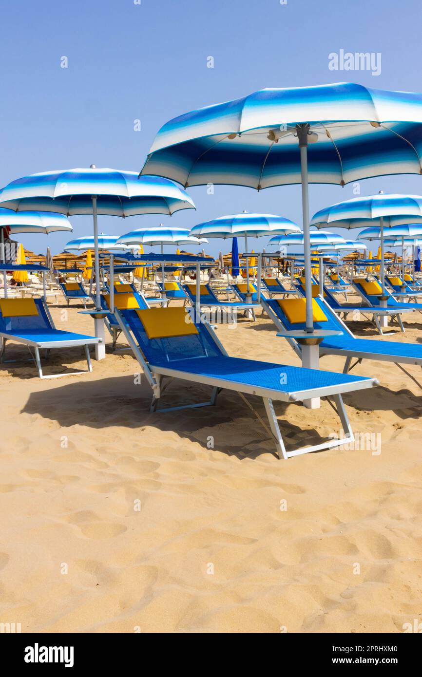 Traditional beach chair and umbrella. Rimini, Italy Stock Photo - Alamy