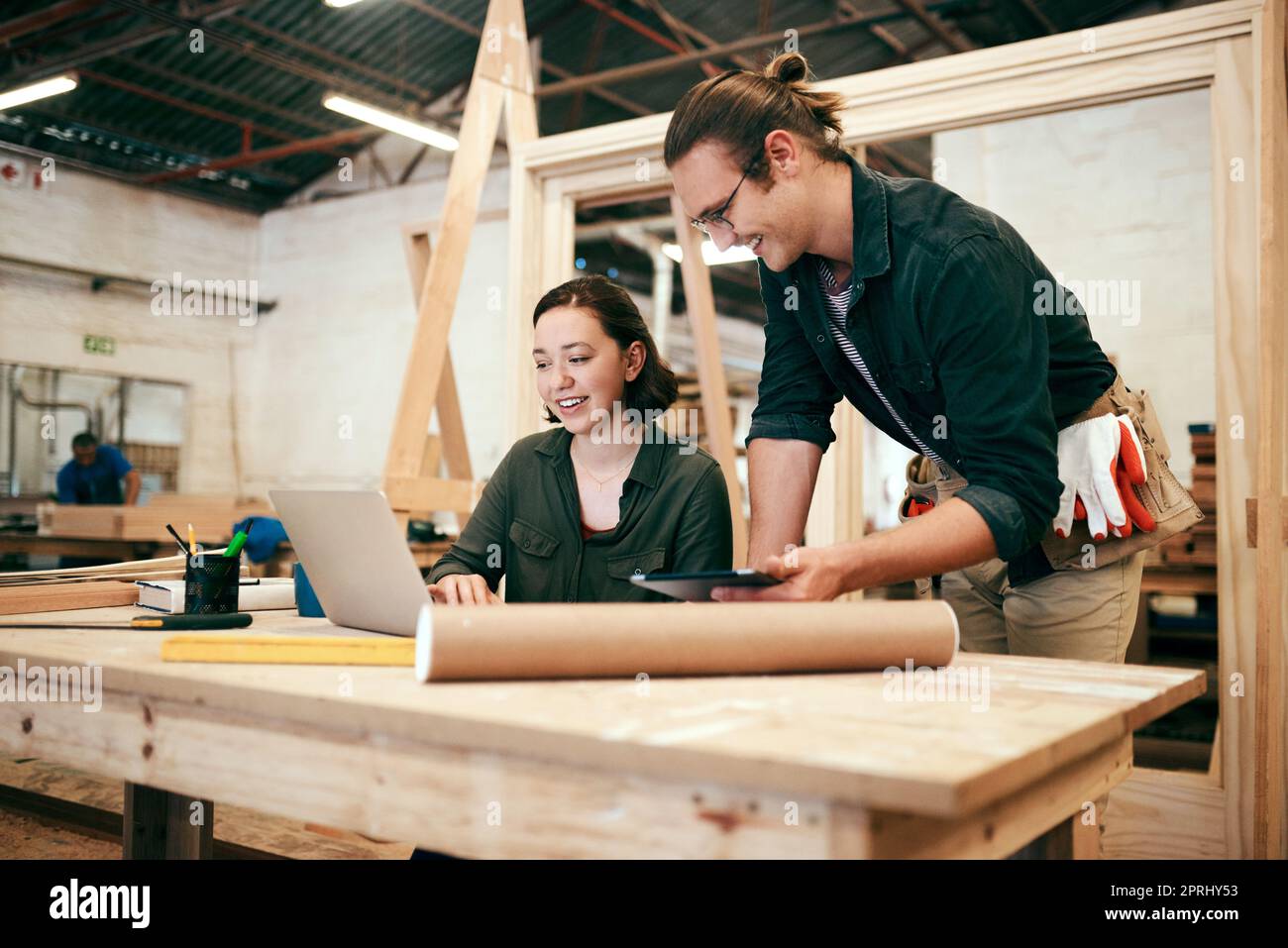 Were handling the digital side of business today. two young carpenters ...