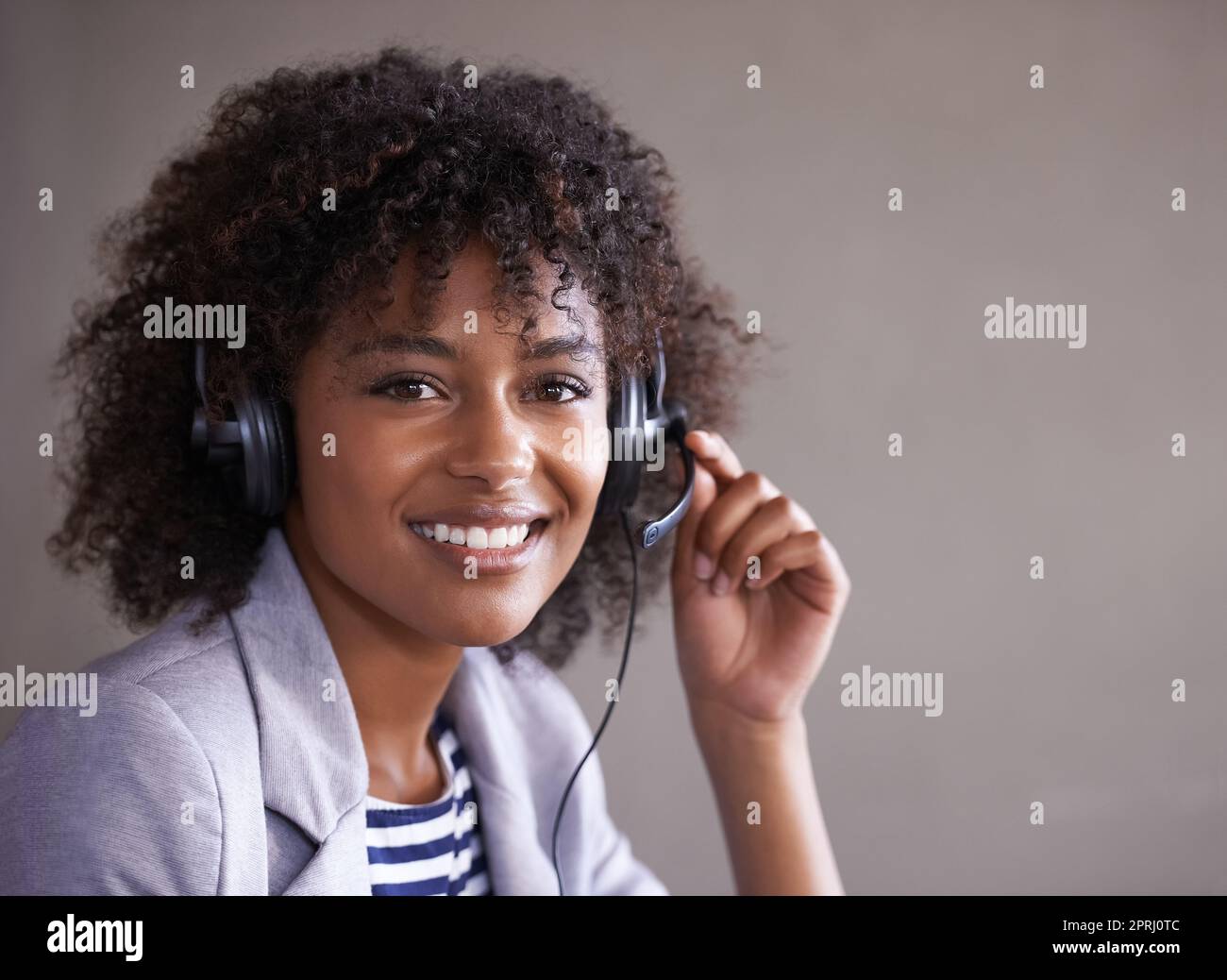 Shes happy to help you. Portrait of a happy young entrepreneur wearing ... Shes happy to help you. Portrait of a happy young entrepreneur wearing ...
