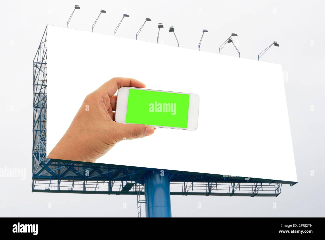 Advertising: Hand holding white smartphone green screen on big ...