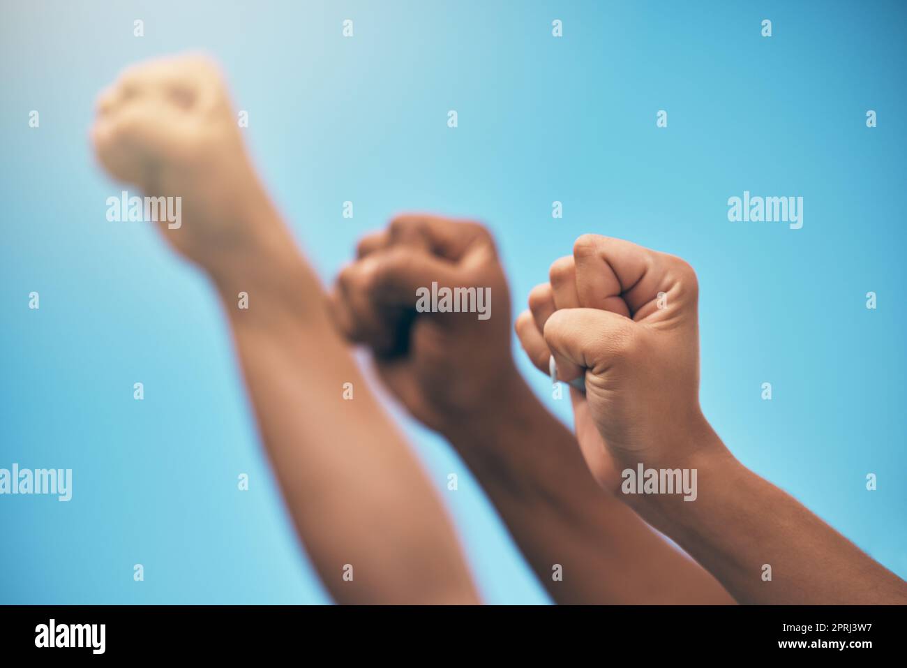 Protest group, hands in air and fist of people for solidarity, equality ...