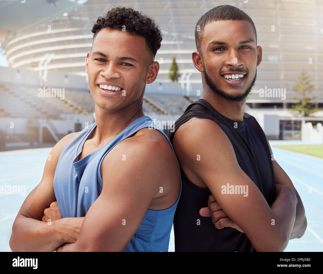 Athlete, standing and back in portrait together on track, field and ...