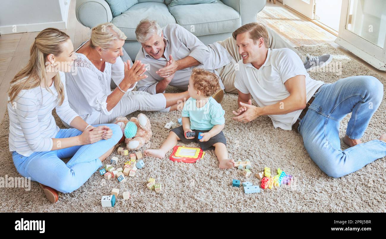 Family in living room play with baby for education and cognitive ...