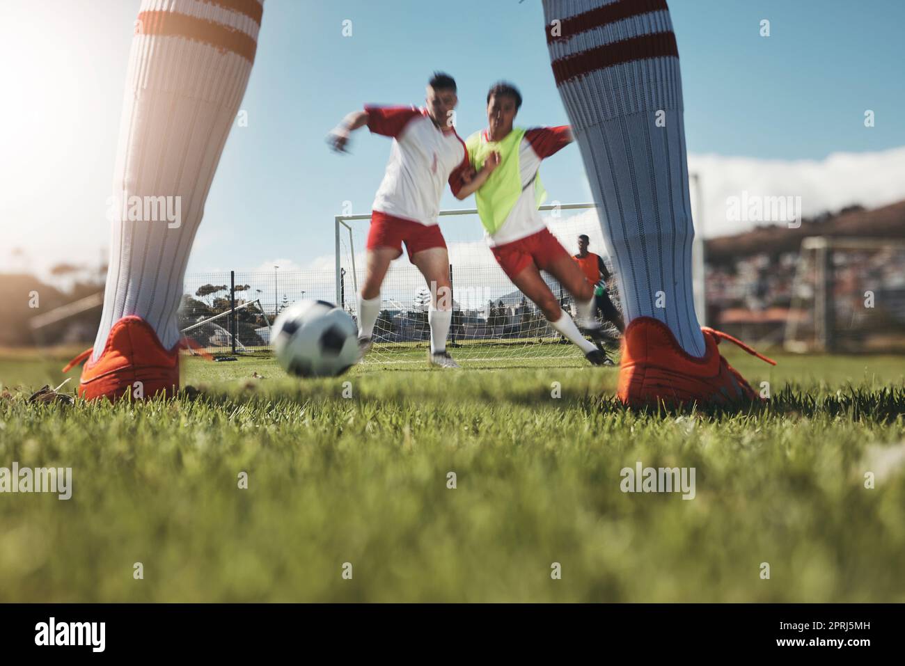 Sports game, football field action and legs of soccer player in ...