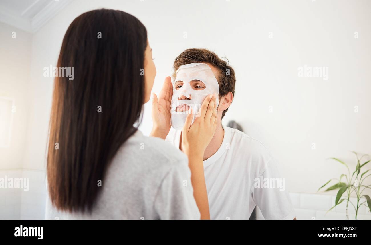 Couple facial in bathroom, beauty mask cleanser on man face and ...