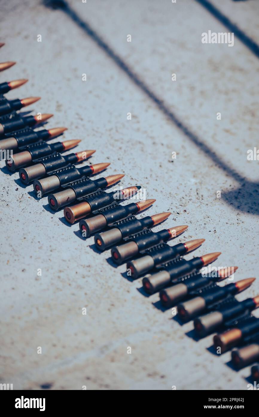 Machine gun belt loaded with cartridges Stock Photo - Alamy