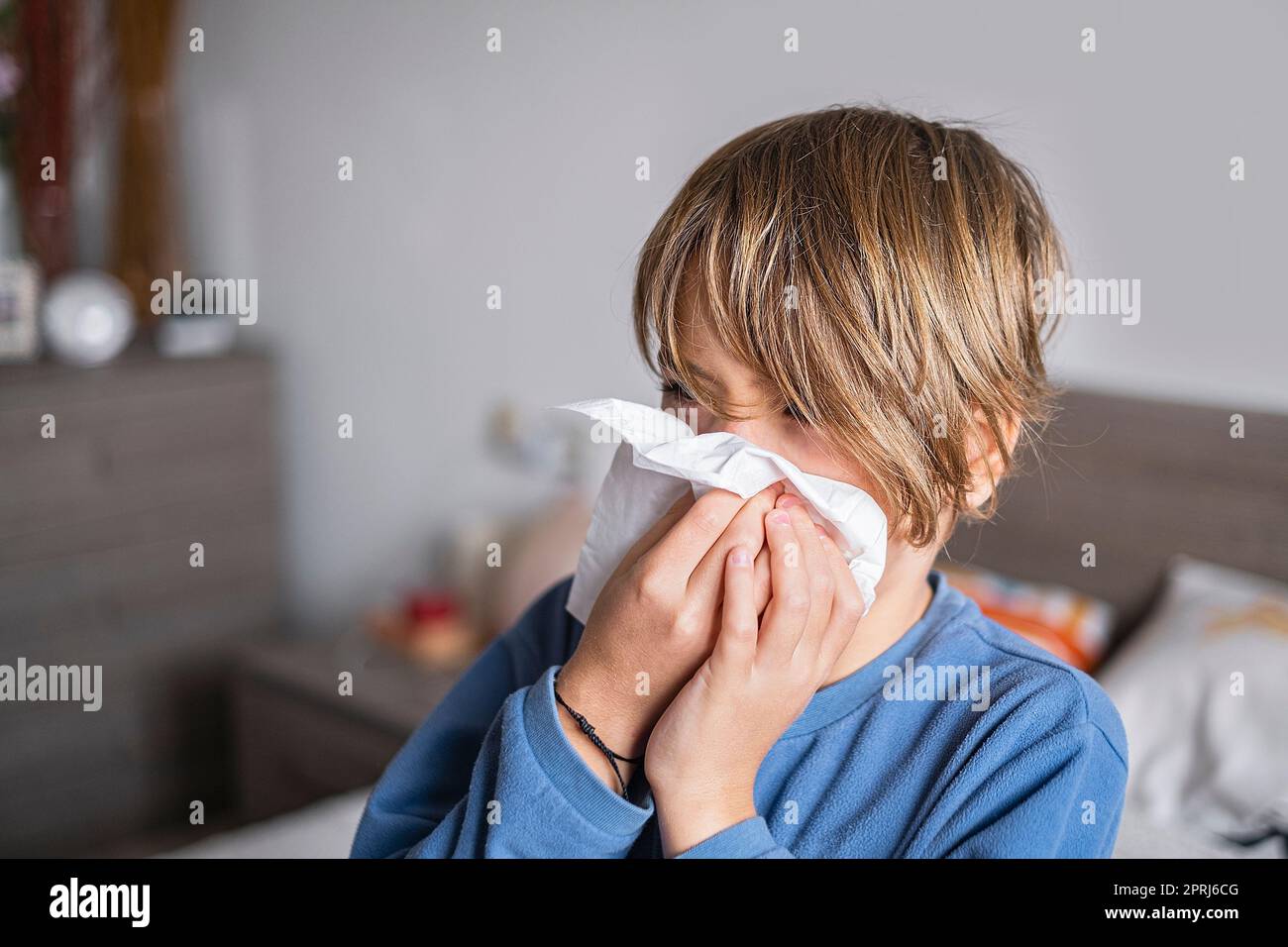 Child boy blow his nose. Allergic kid, flu season. Kid with cold ...