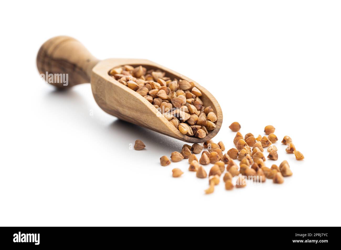Uncooked buckwheat grain in scoop isolated on white background Stock ...