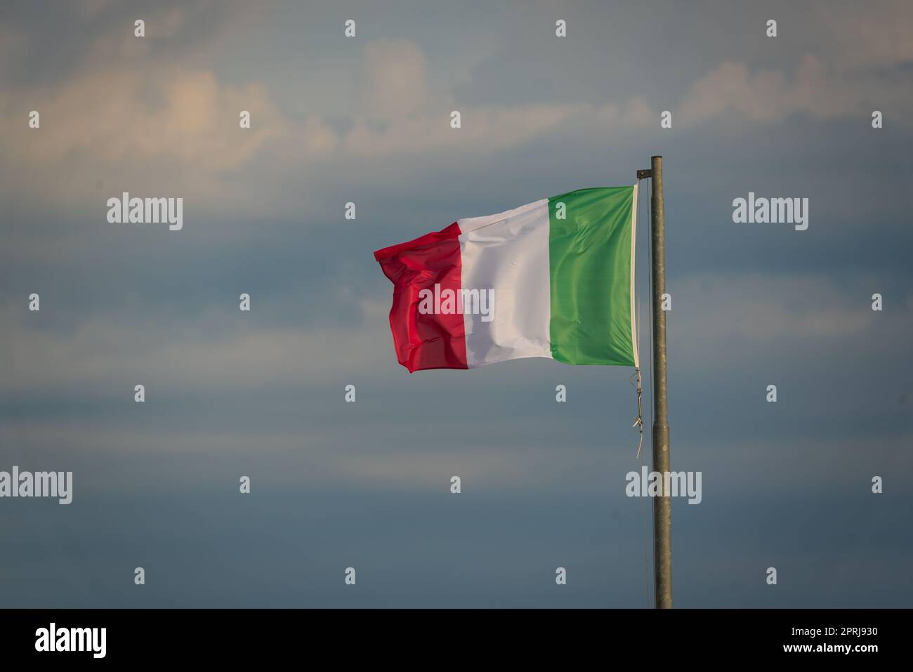 Large Italian flag waving in the wind at sunrise Stock Photo - Alamy