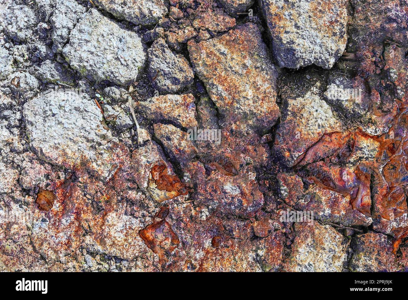 Detailed close up surface of rusty metal and stone with lots of ...
