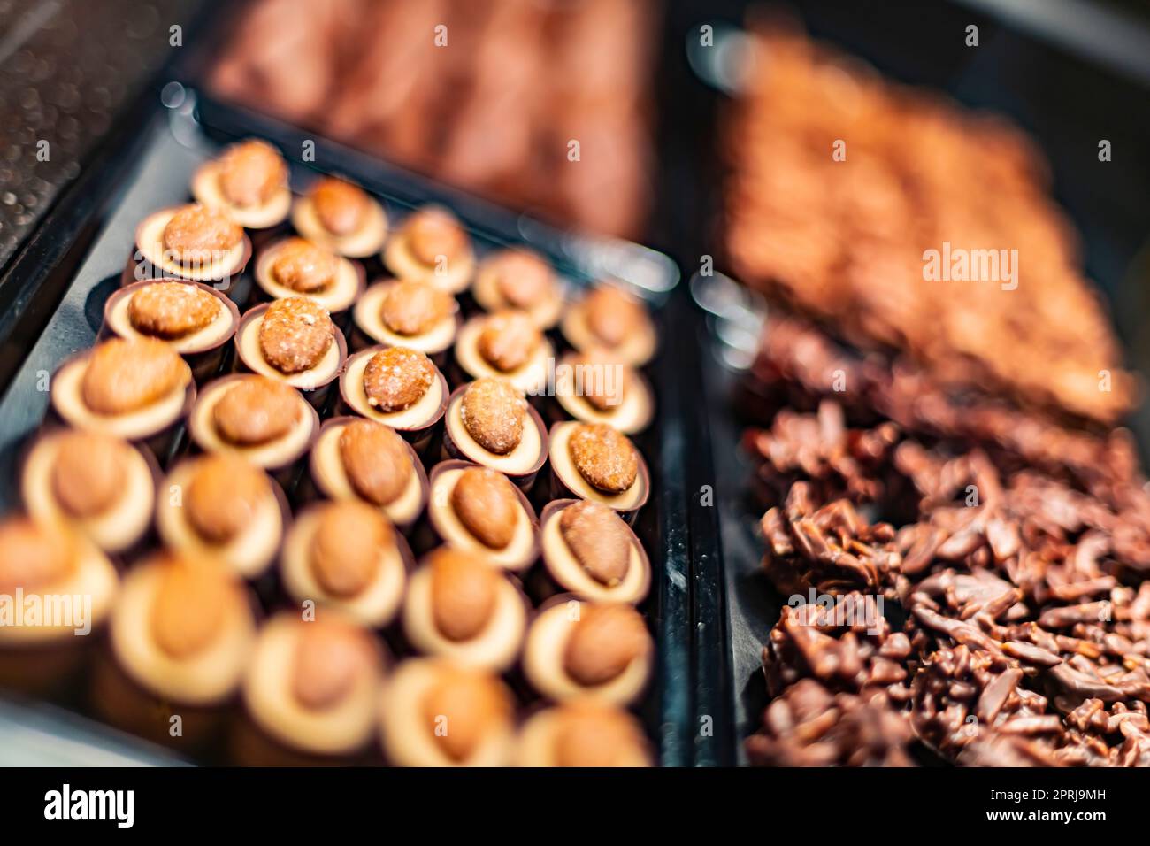 Chocolate pralines displayed in a confectionery store Stock Photo - Alamy