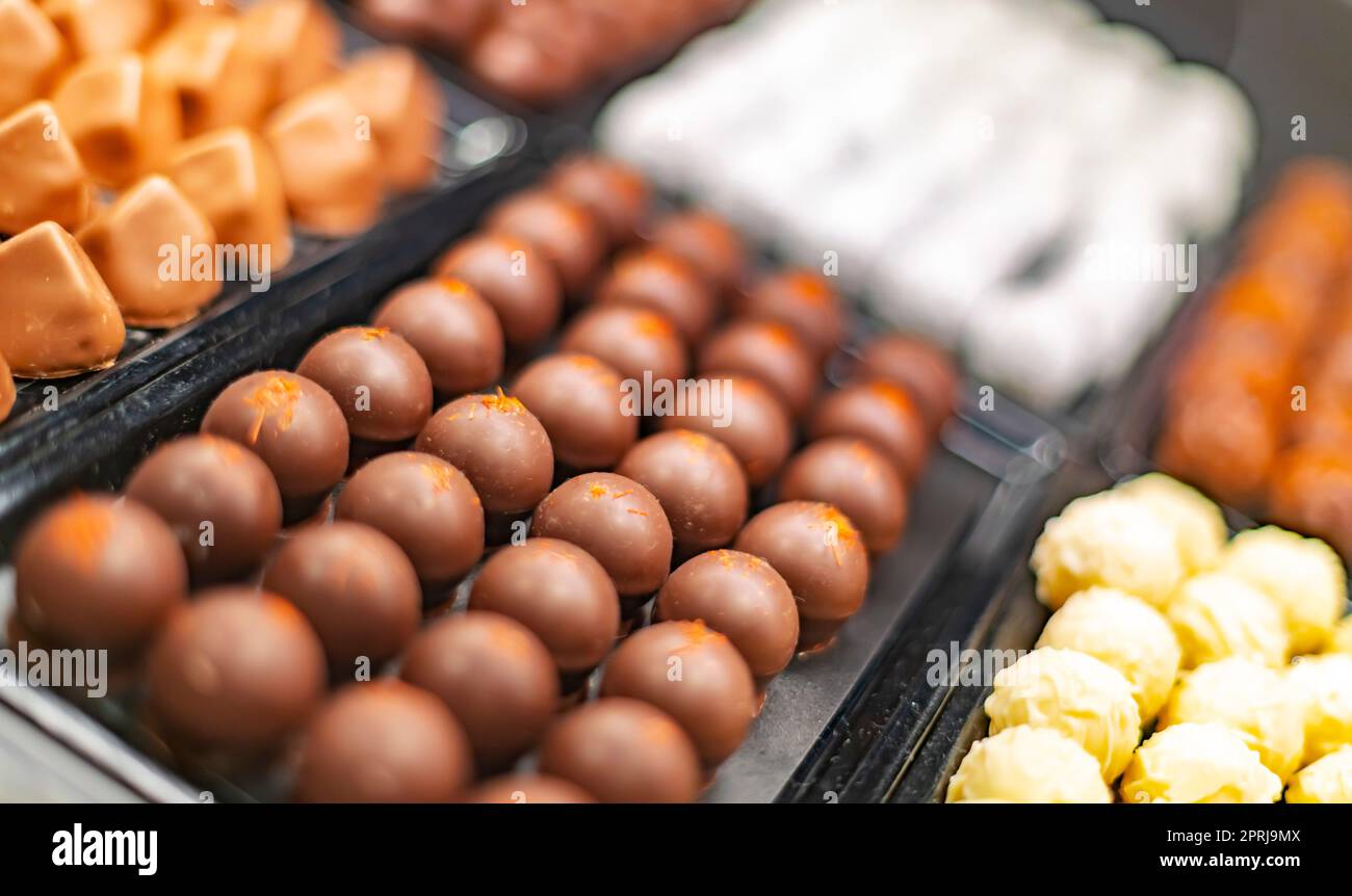 Chocolate pralines displayed in a confectionery store Stock Photo - Alamy