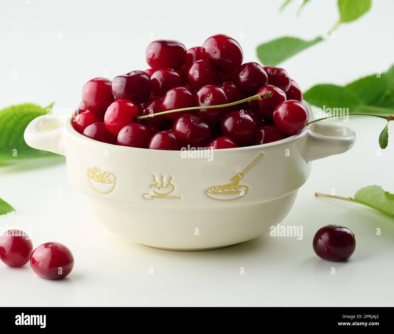 Ripe red cherries in plate hi-res stock photography and images - Alamy