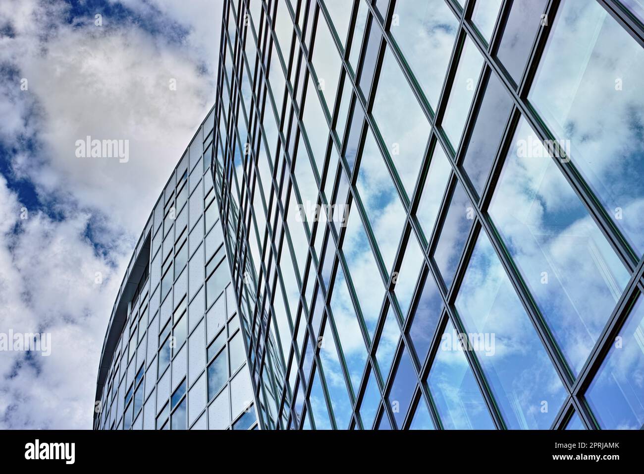 Modern architecture. Low angle view of a tall building with glass ...