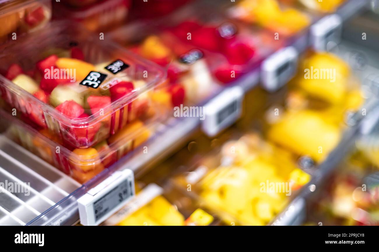 Packages with fruits displayed in a commercial refrigerator Stock Photo ...