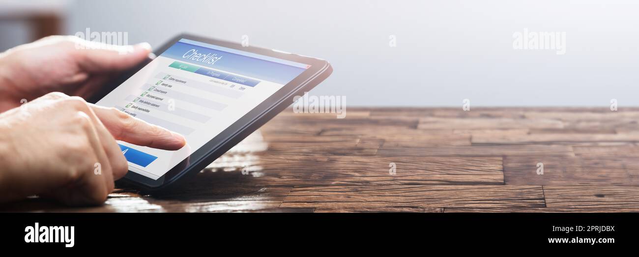 Filling Online Checklist Survey Form. Tablet Software Stock Photo - Alamy