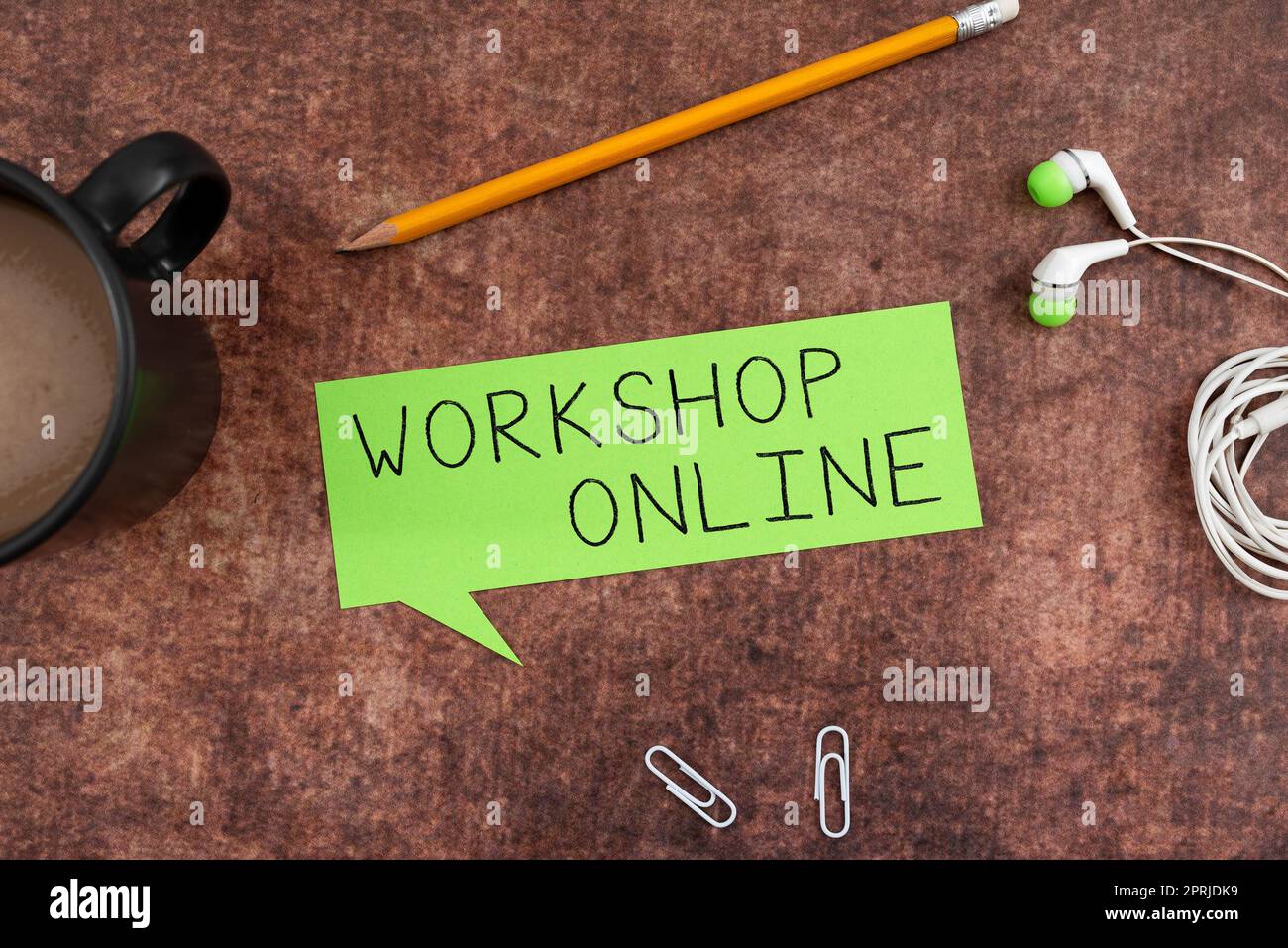 Text sign showing Workshop Onlineroom or building in which goods are ...