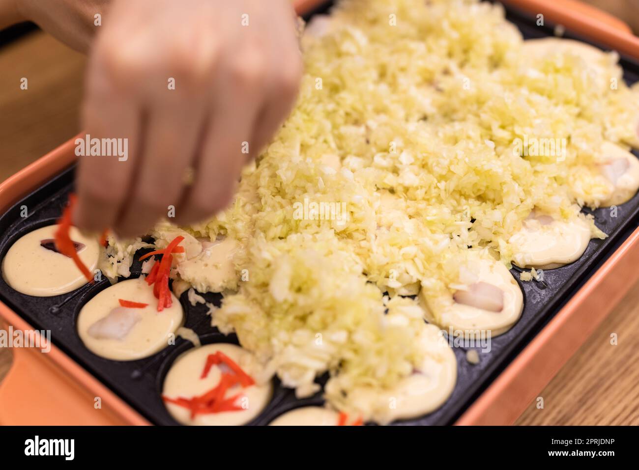 Making takoyaki, Octopus ball at home Stock Photo - Alamy