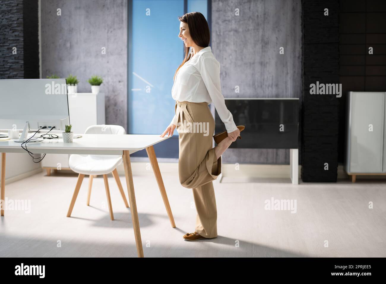 Standing Office Yoga Workout And Workout Near Business Computer Stock ...