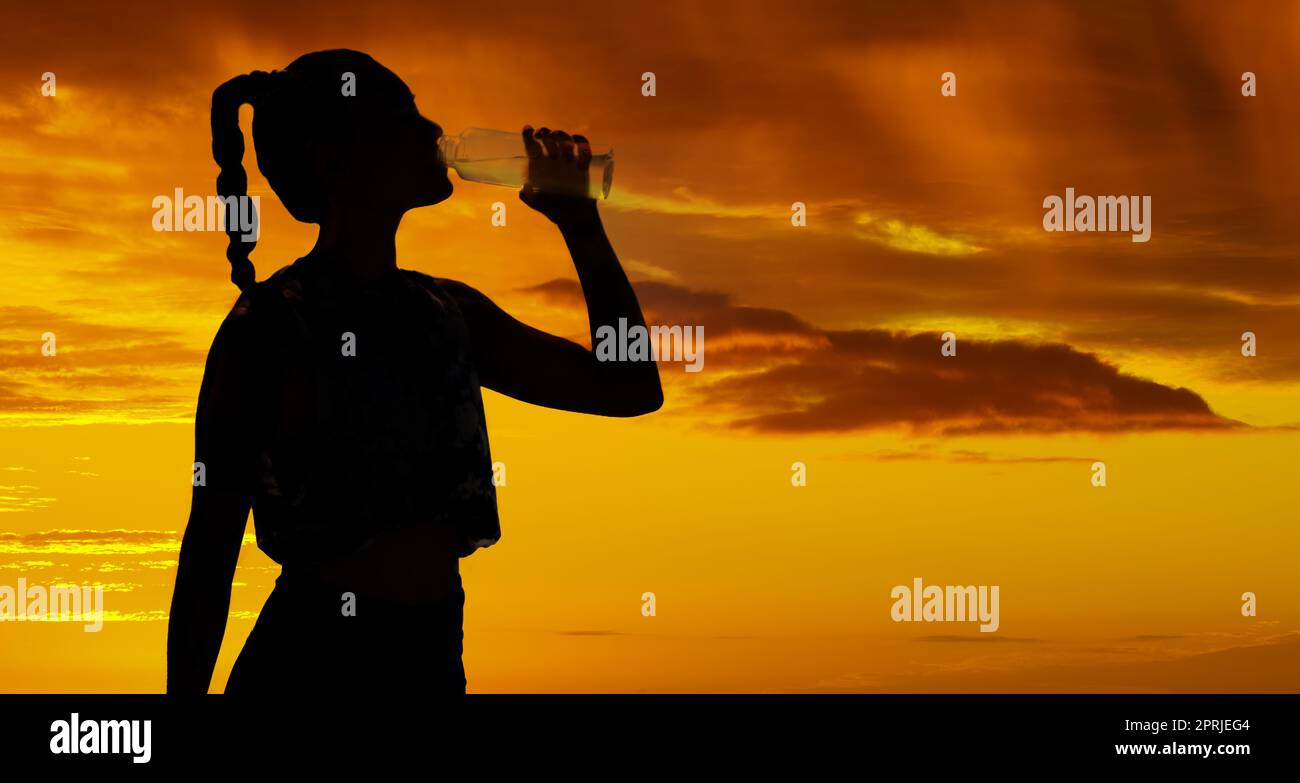 Silhouette woman holding water bottle hi-res stock photography and ...