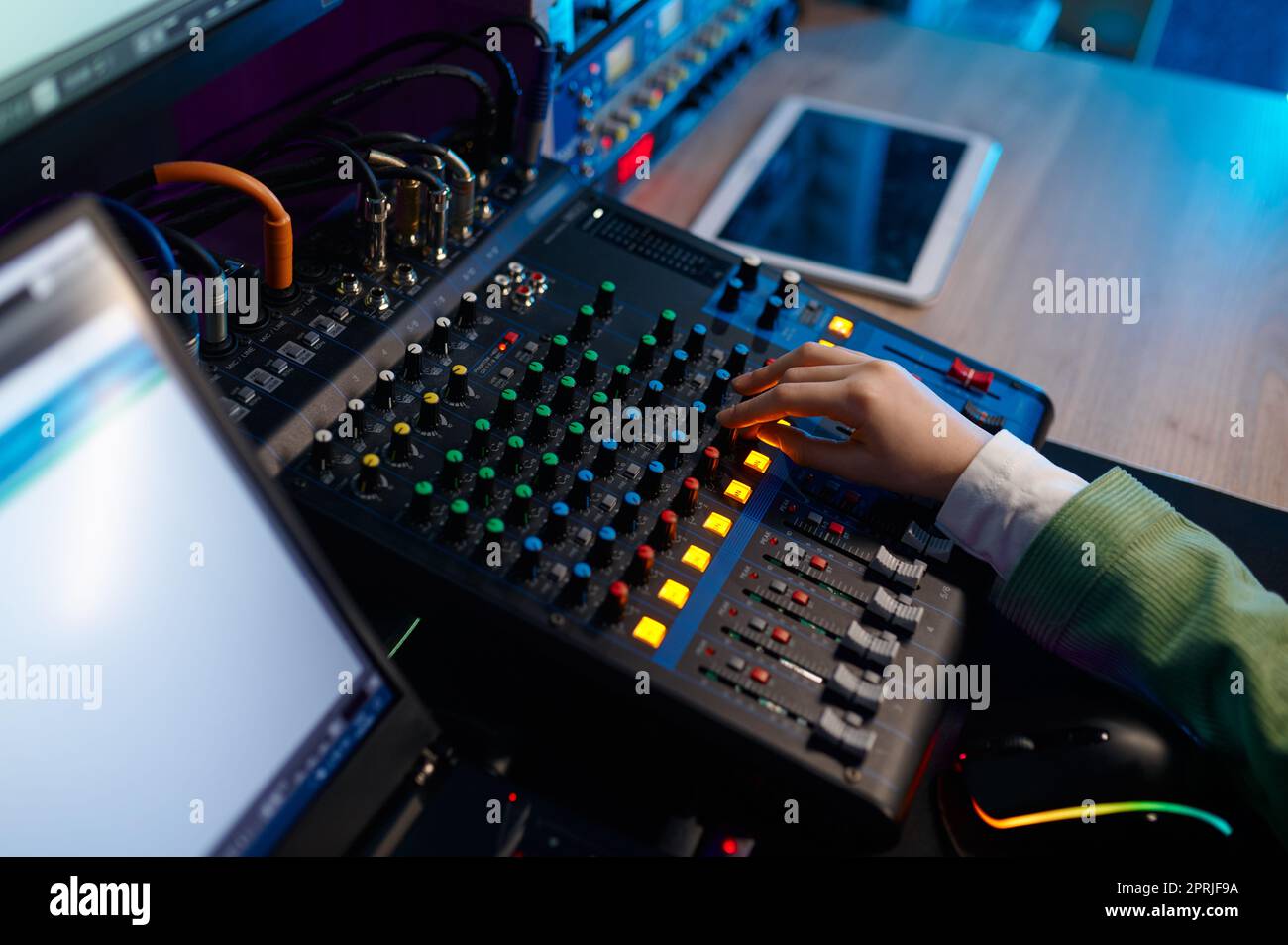 Closeup audio engineer hand mixing sound Stock Photo - Alamy
