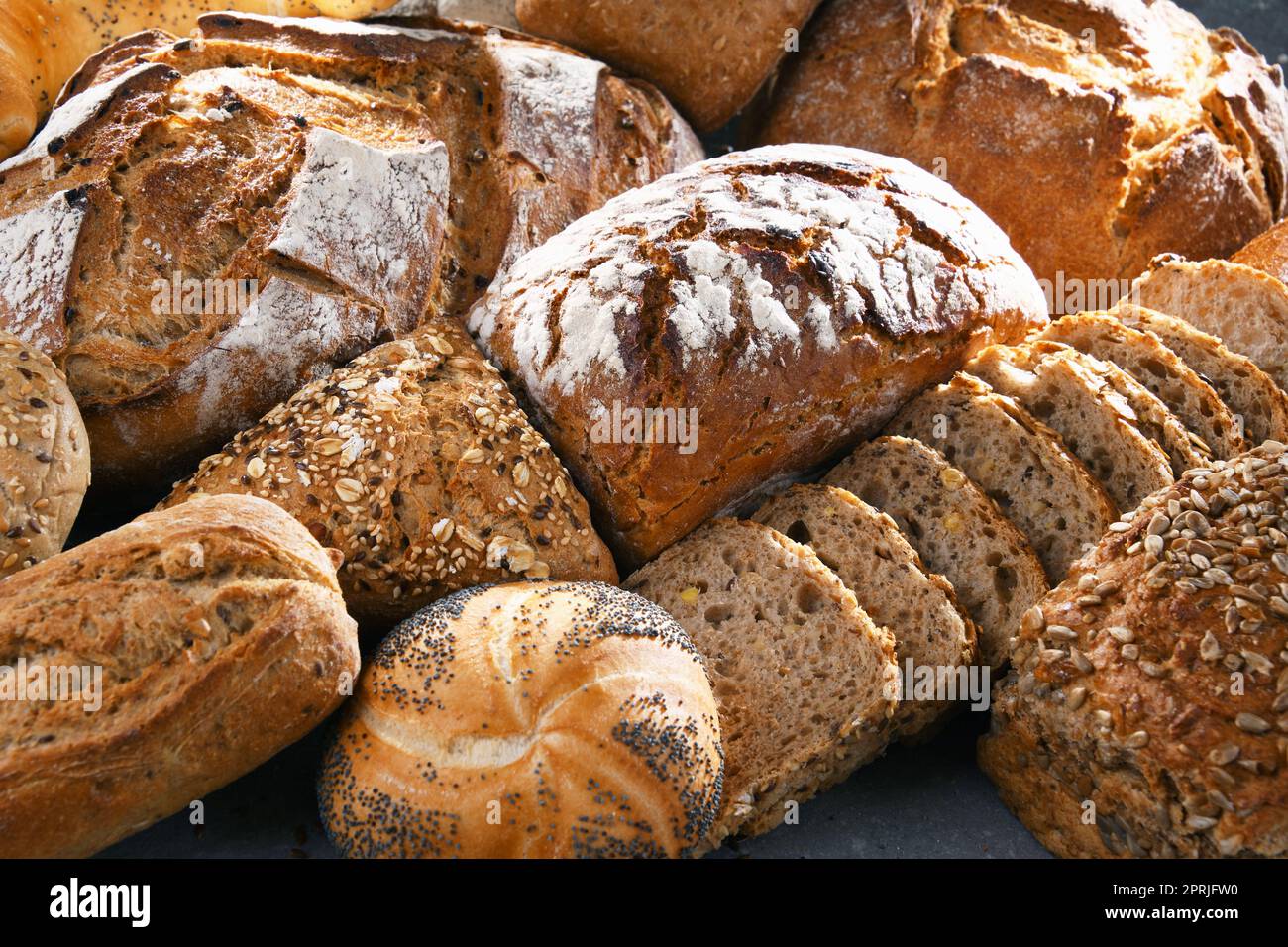 Assorted bakery products including loafs of bread and rolls Stock Photo ...