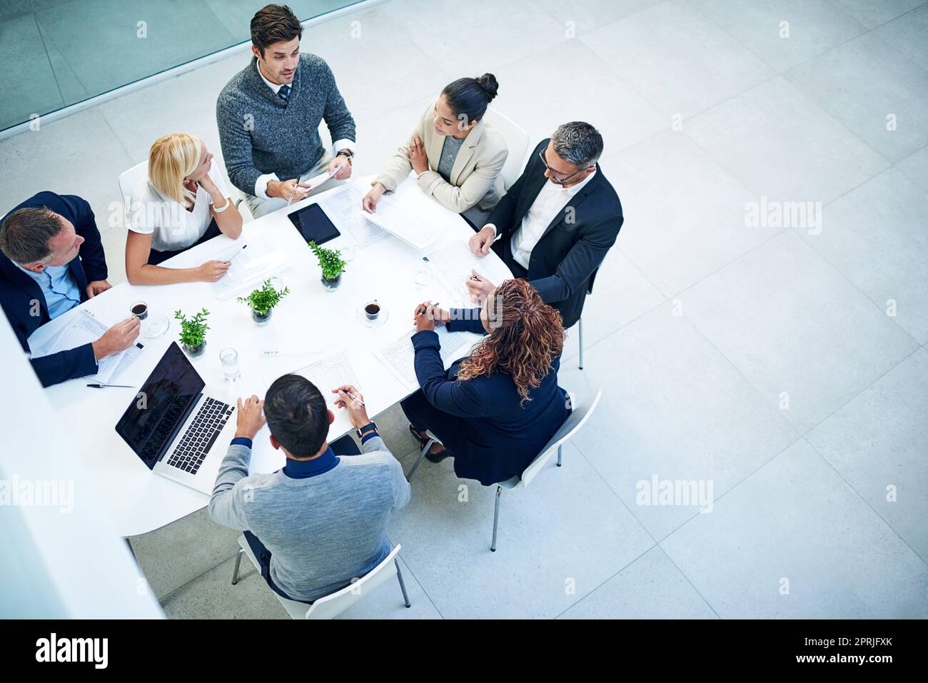 Success is the product of teamwork. corporate colleagues working ...