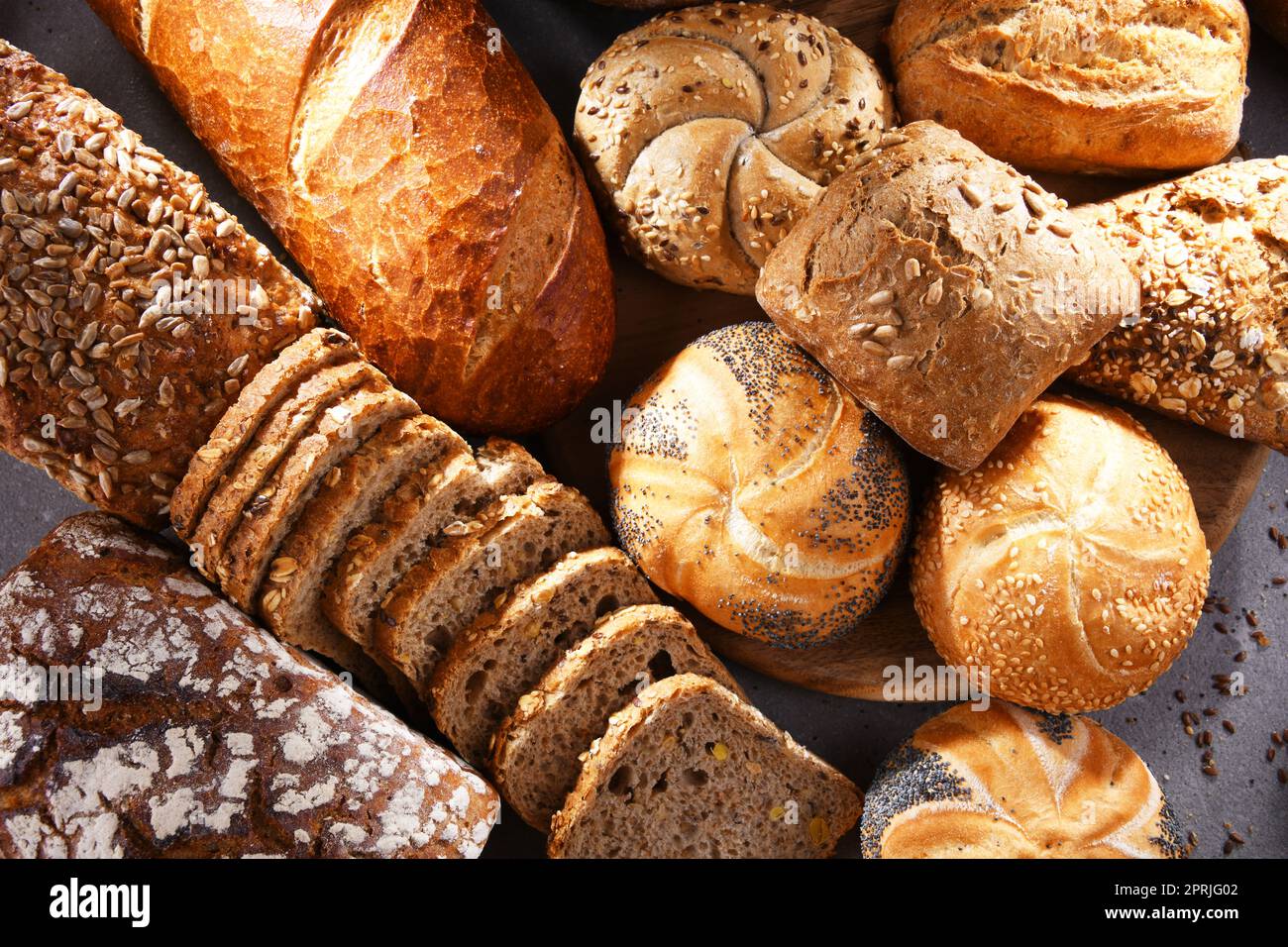 Assorted bakery products including loafs of bread and rolls Stock Photo ...