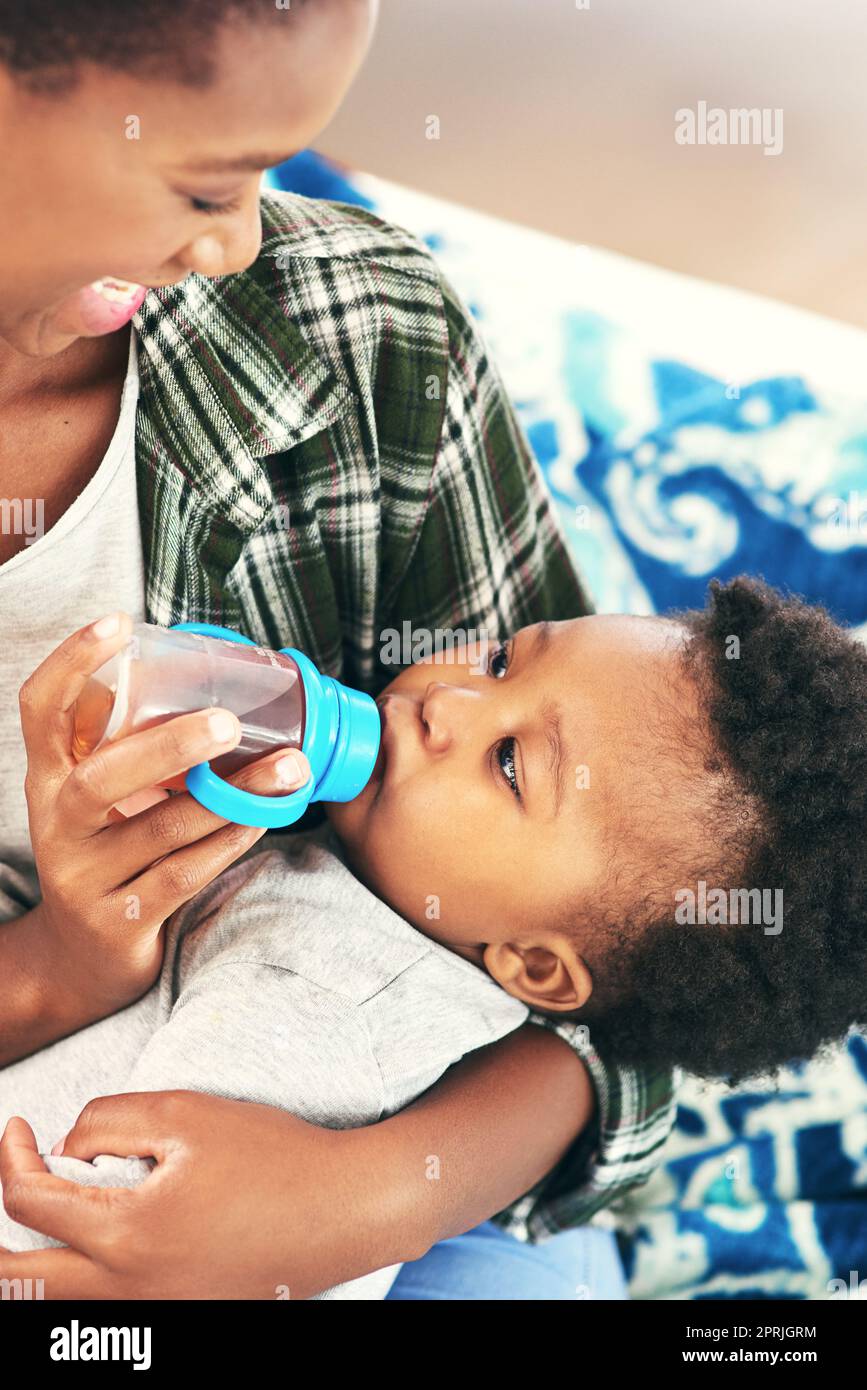 Mommys favorite little guy. a mother giving her little baby boy a ...