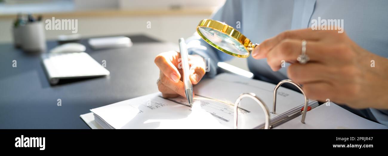 Corporate Auditor Using Magnifying Glass Stock Photo - Alamy