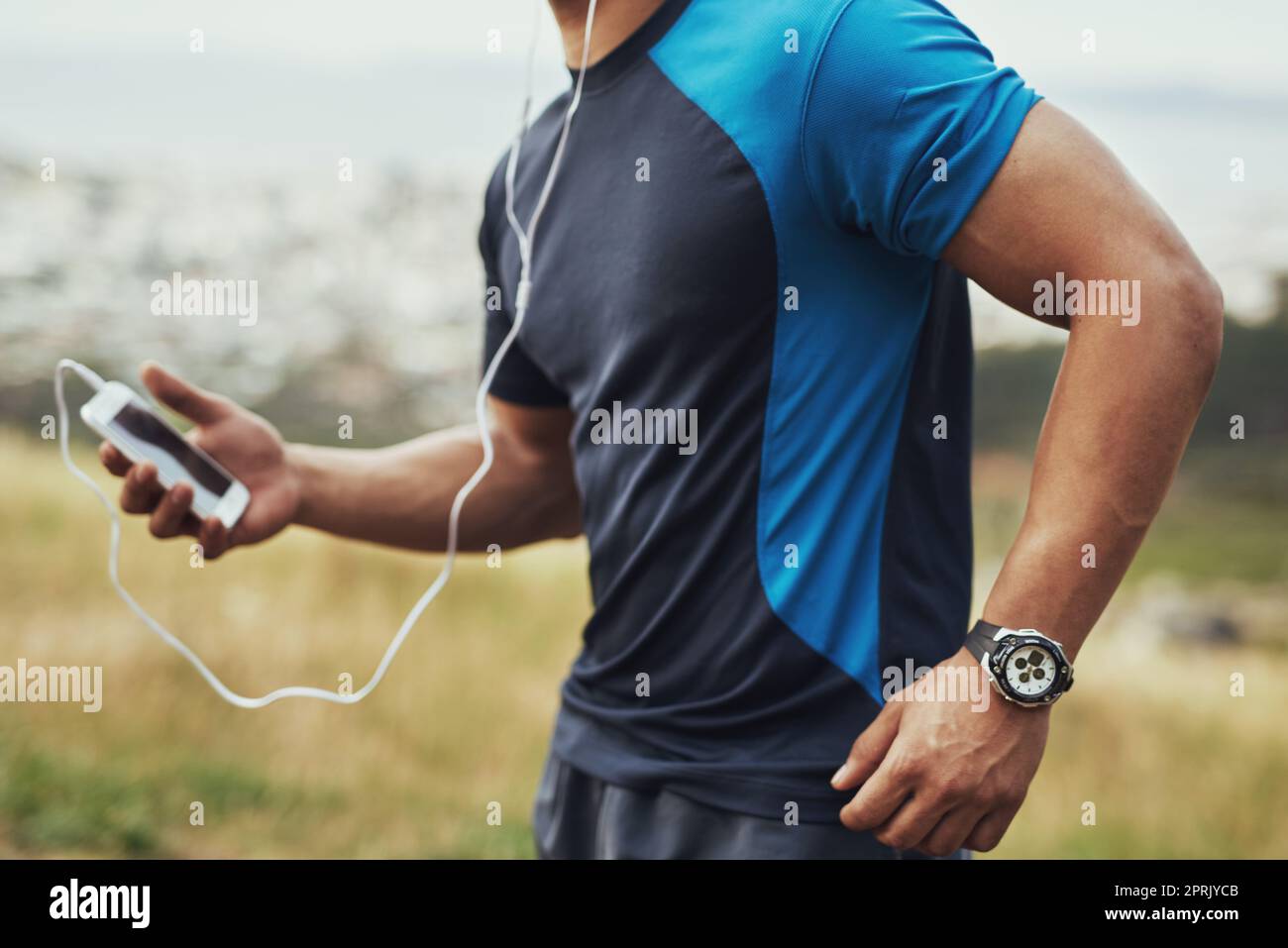 Matching the track to the terrain. a young man running outdoors Stock ...