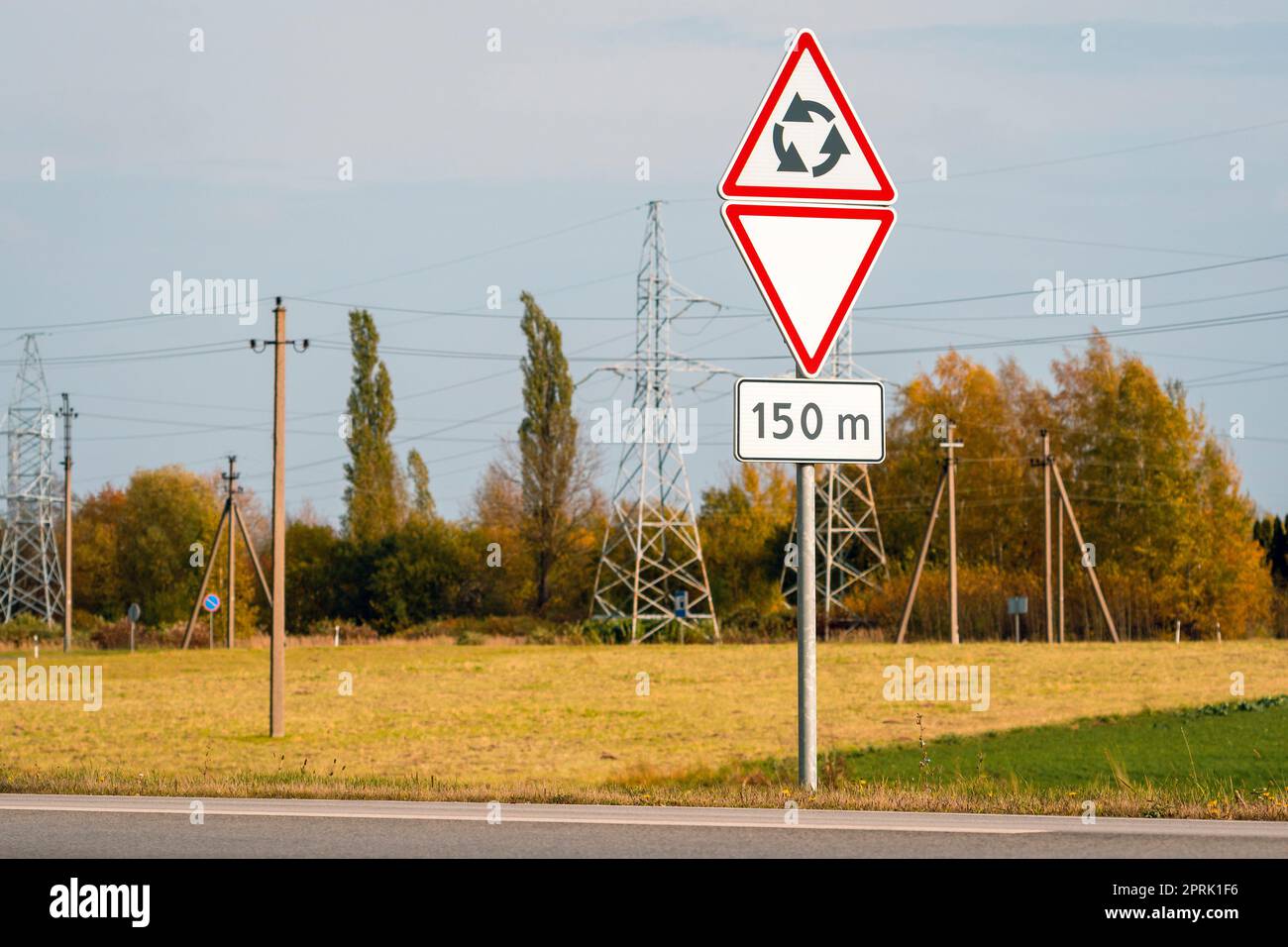 Give way sign at a roundabout. Circular motion. Traffic signs Stock ...
