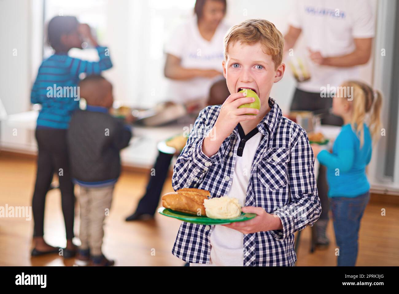 Nutrition above all. Portrait of a little boy with a plate of food with ...