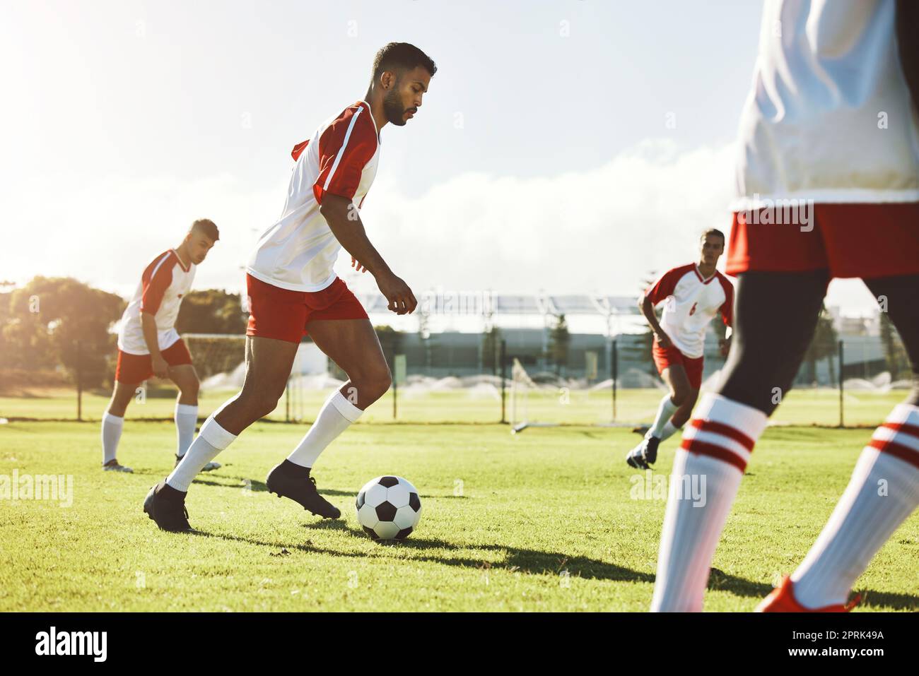 Team sports game, soccer and teamwork of men busy with football ...