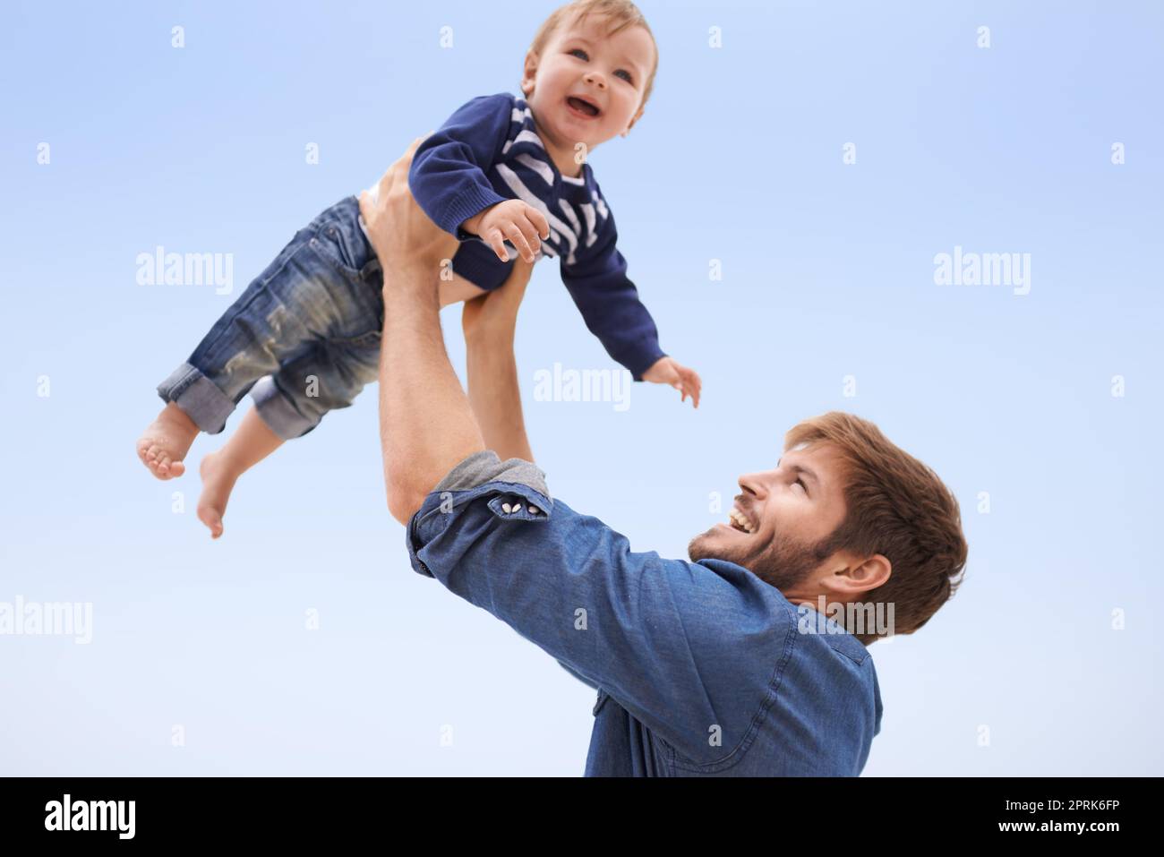 A man lifting a small boy up hi-res stock photography and images - Alamy