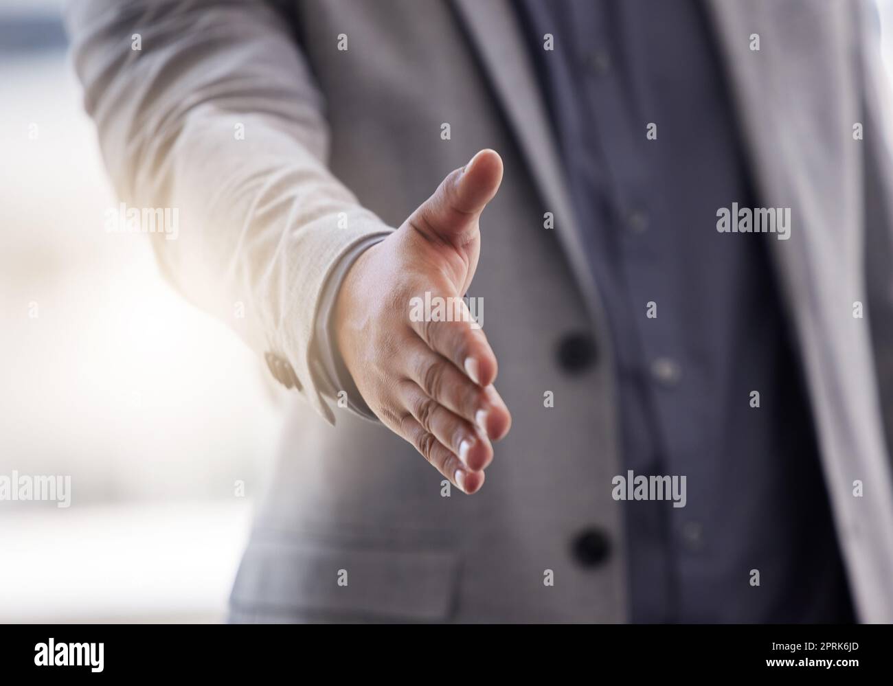 Businessman holding hand out handshake hi-res stock photography and ...