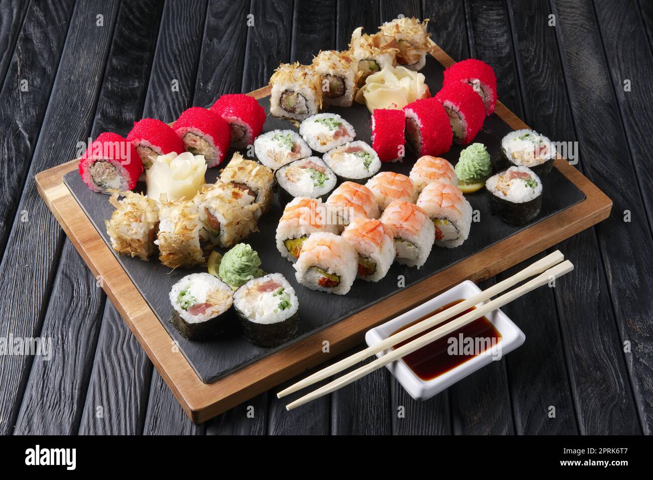Big set of rolls served on stone plate. Layout for menu Stock Photo - Alamy