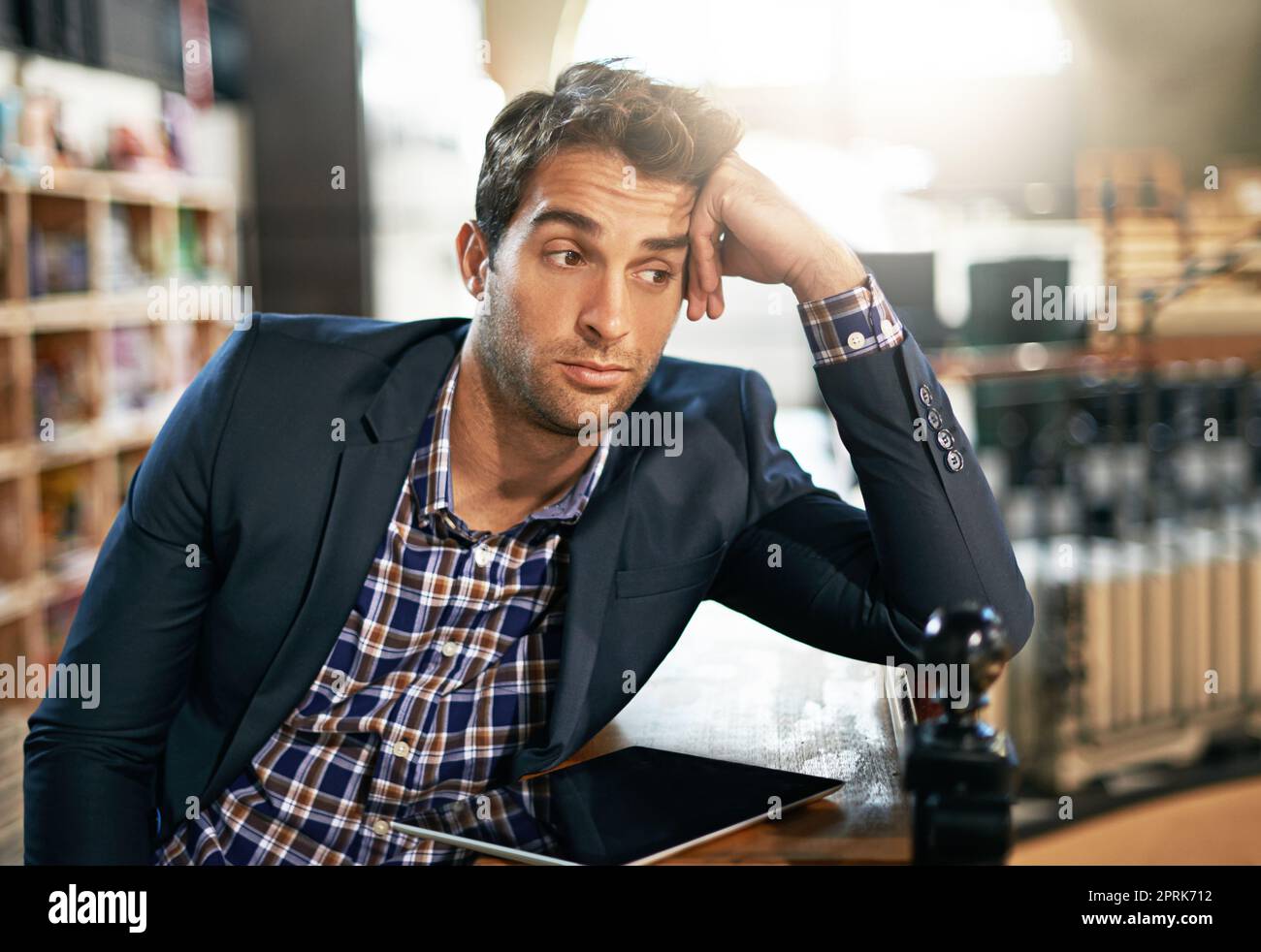 Sad looking men sitting table hi-res stock photography and images - Alamy