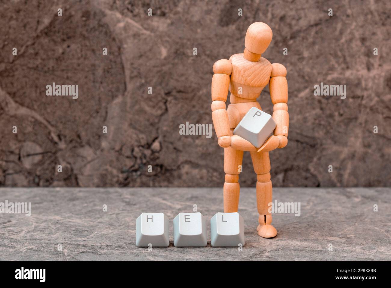 Dummy puts computer keyboard key with letter P from the word HELP ...