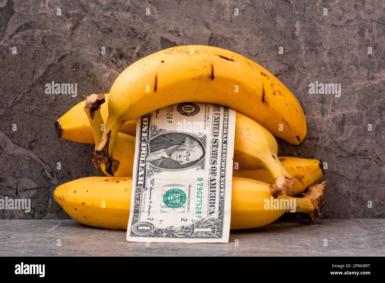 Pile of ripe bananas with one dollar banknote. Conceptual image Stock ...
